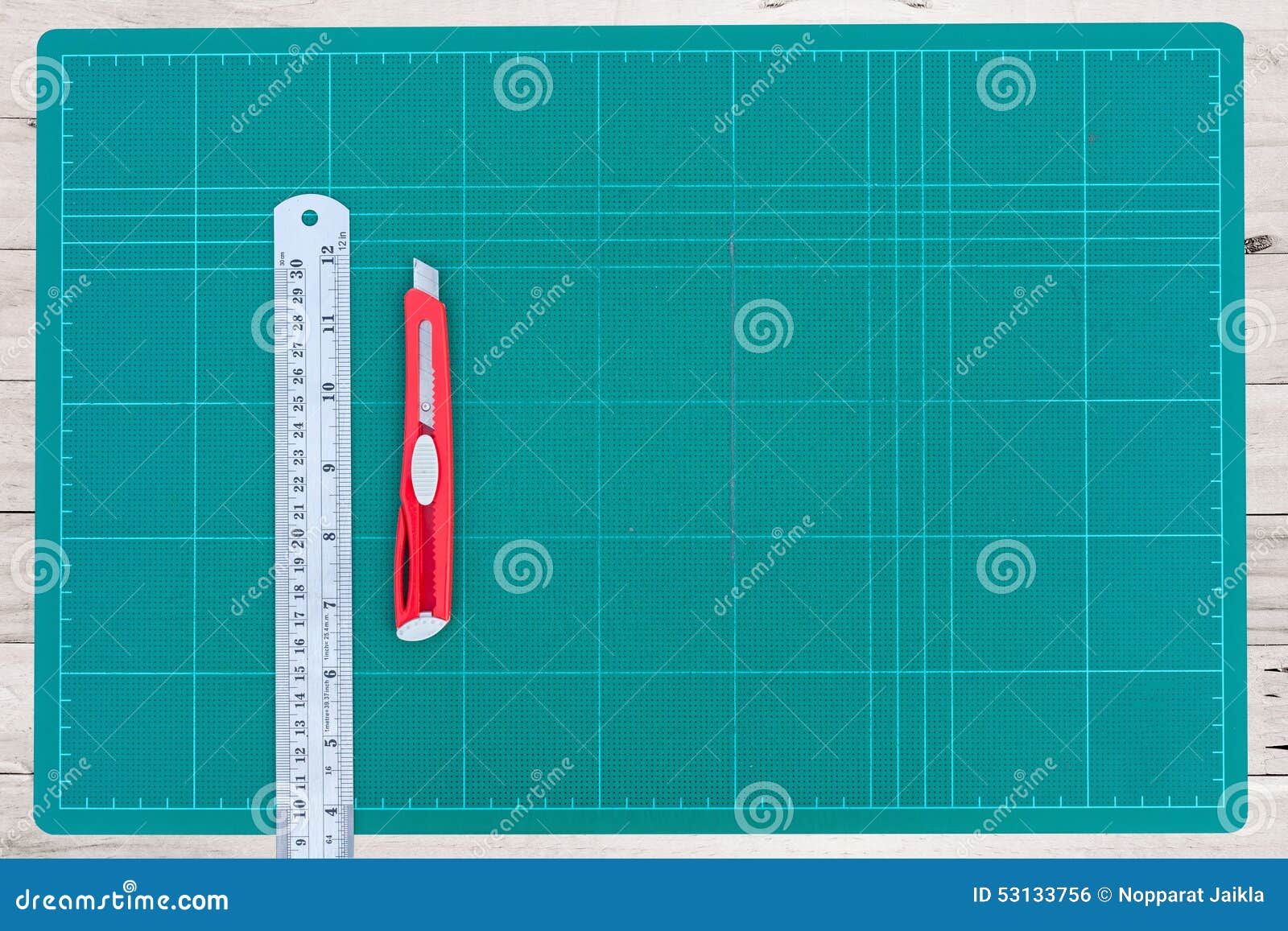 A Ruler and Cutter on Green Cutting Mat Stock Photo - Image of single ...