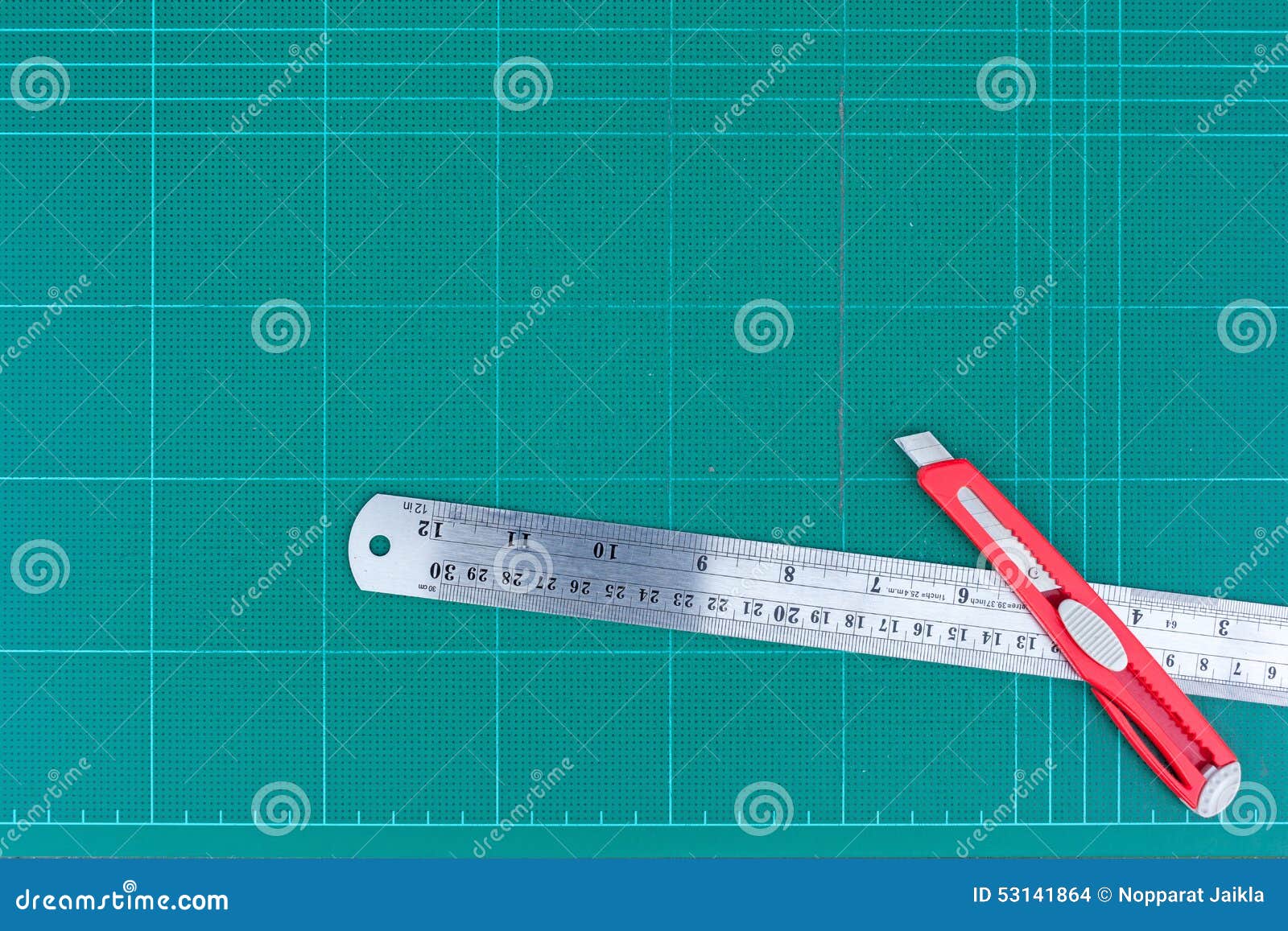 A Ruler and Cutter on Green Cutting Mat Stock Photo - Image of clipping ...