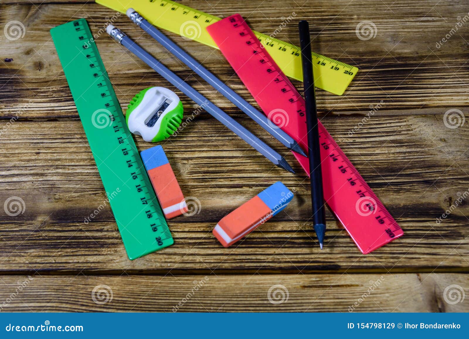 Rulers, Pencils and Erasers on a Wooden Table Stock Image - Image of ...