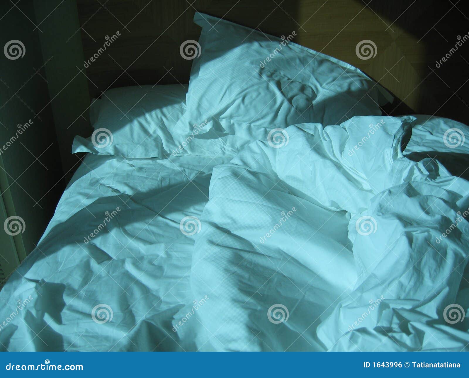 Rumpled bed stock photo. Image of blue, light, shadows - 1643996