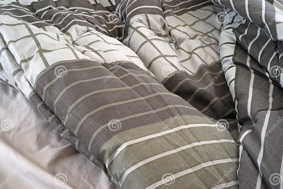 Rumpled Bed Comforter and Sheets Stock Image - Image of creased ...
