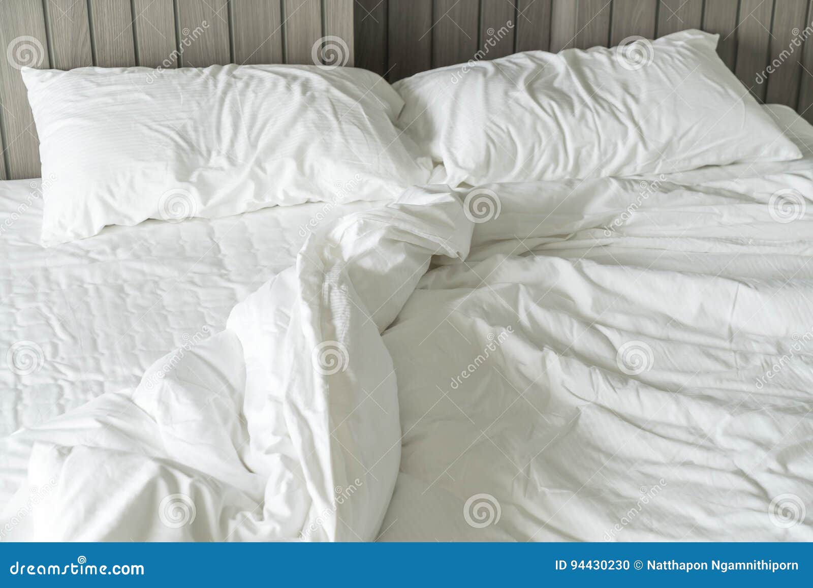 Rumpled Bed with White Messy Pillow Decoration in Bedroom Stock Photo ...