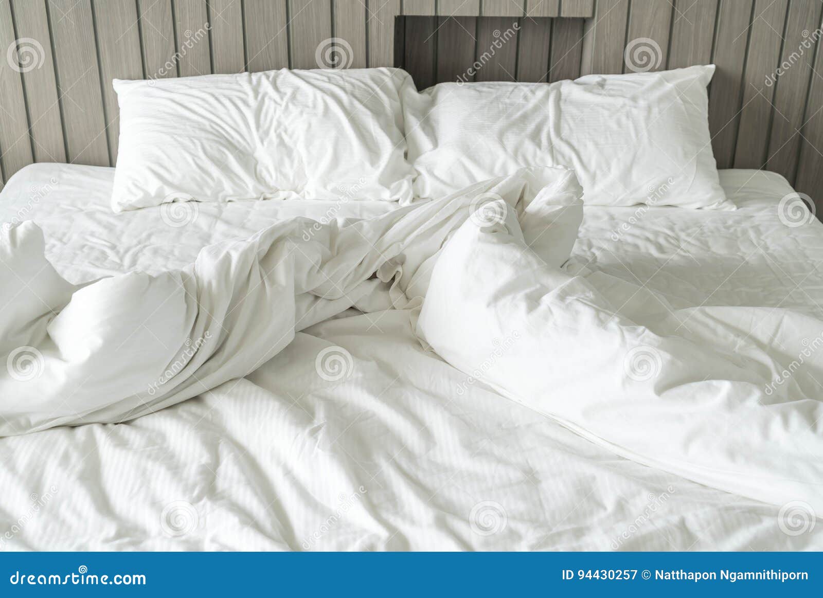 Rumpled Bed with White Messy Pillow Decoration in Bedroom Stock Image ...
