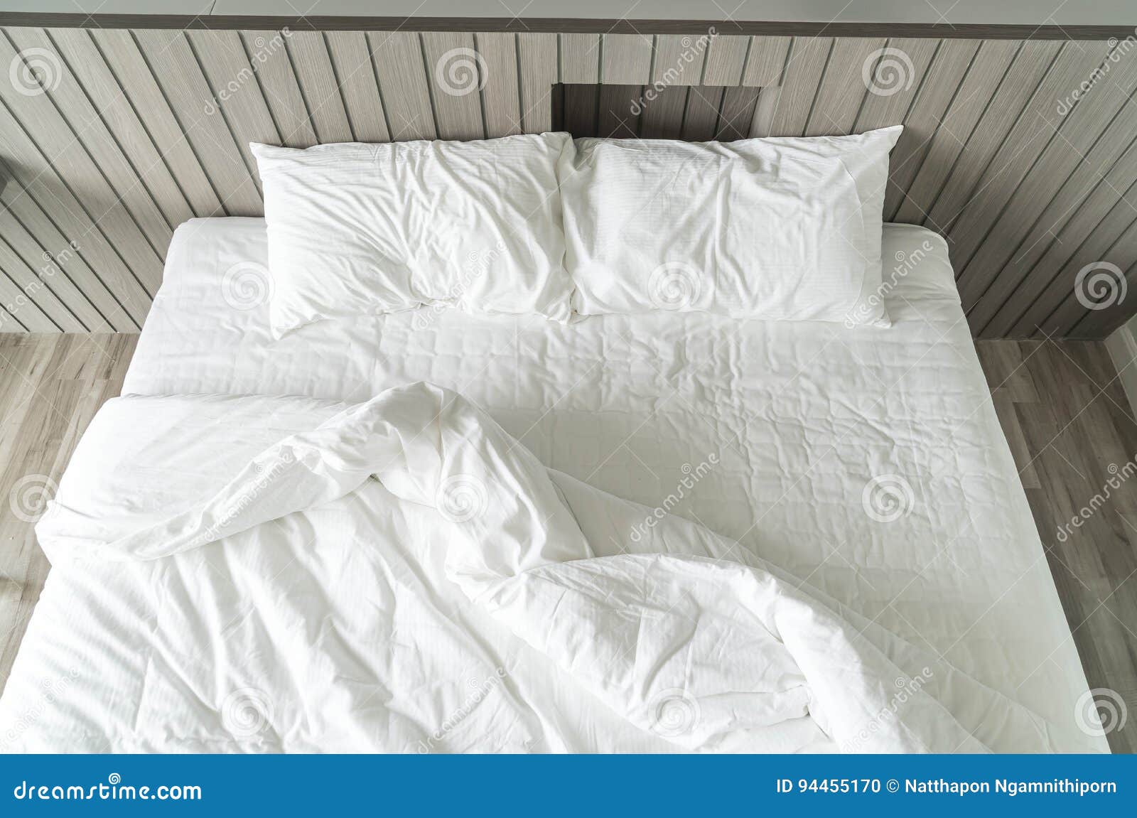 Rumpled Bed with White Messy Pillow Decoration in Bedroom Stock Photo ...
