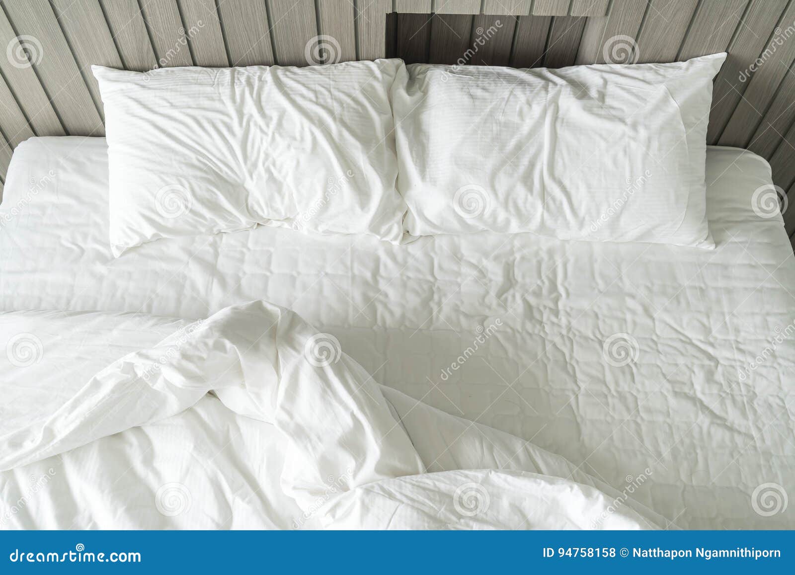 Rumpled Bed with White Messy Pillow Decoration in Bedroom Stock Photo ...