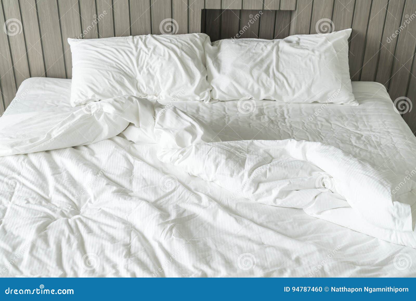 Rumpled Bed with White Messy Pillow Decoration in Bedroom Stock Photo ...