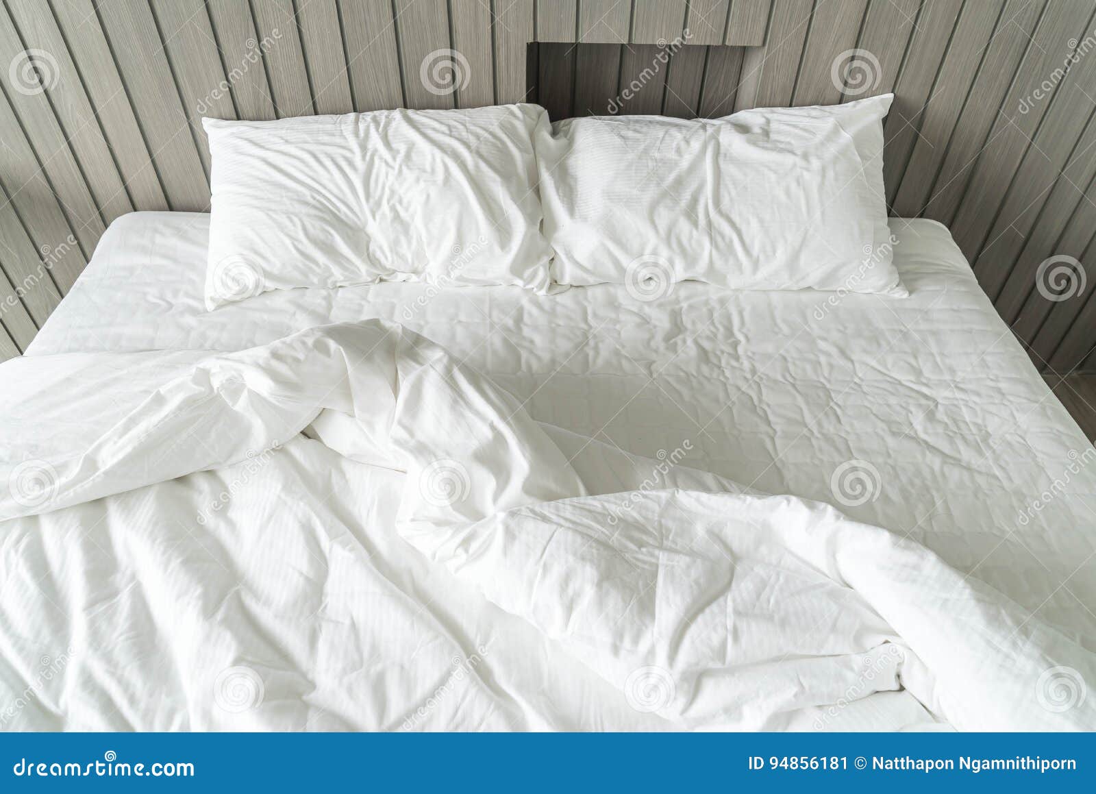 Rumpled Bed with White Messy Pillow Decoration in Bedroom Stock Image ...