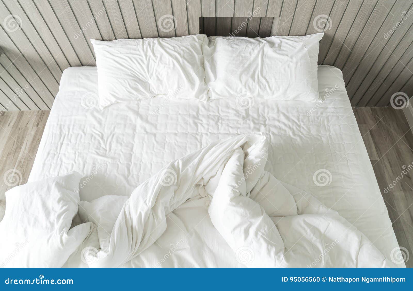 Rumpled Bed with White Messy Pillow Decoration in Bedroom Stock Photo ...