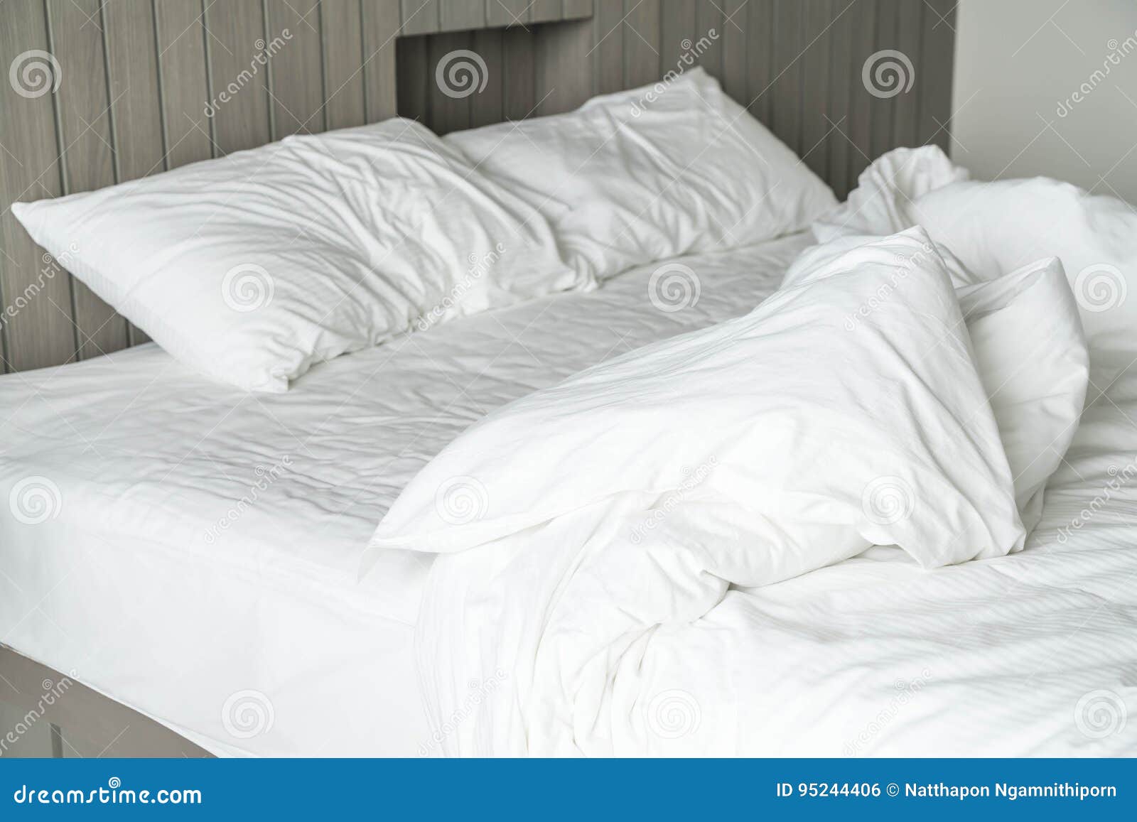 Rumpled Bed with White Messy Pillow Decoration in Bedroom Stock Photo ...