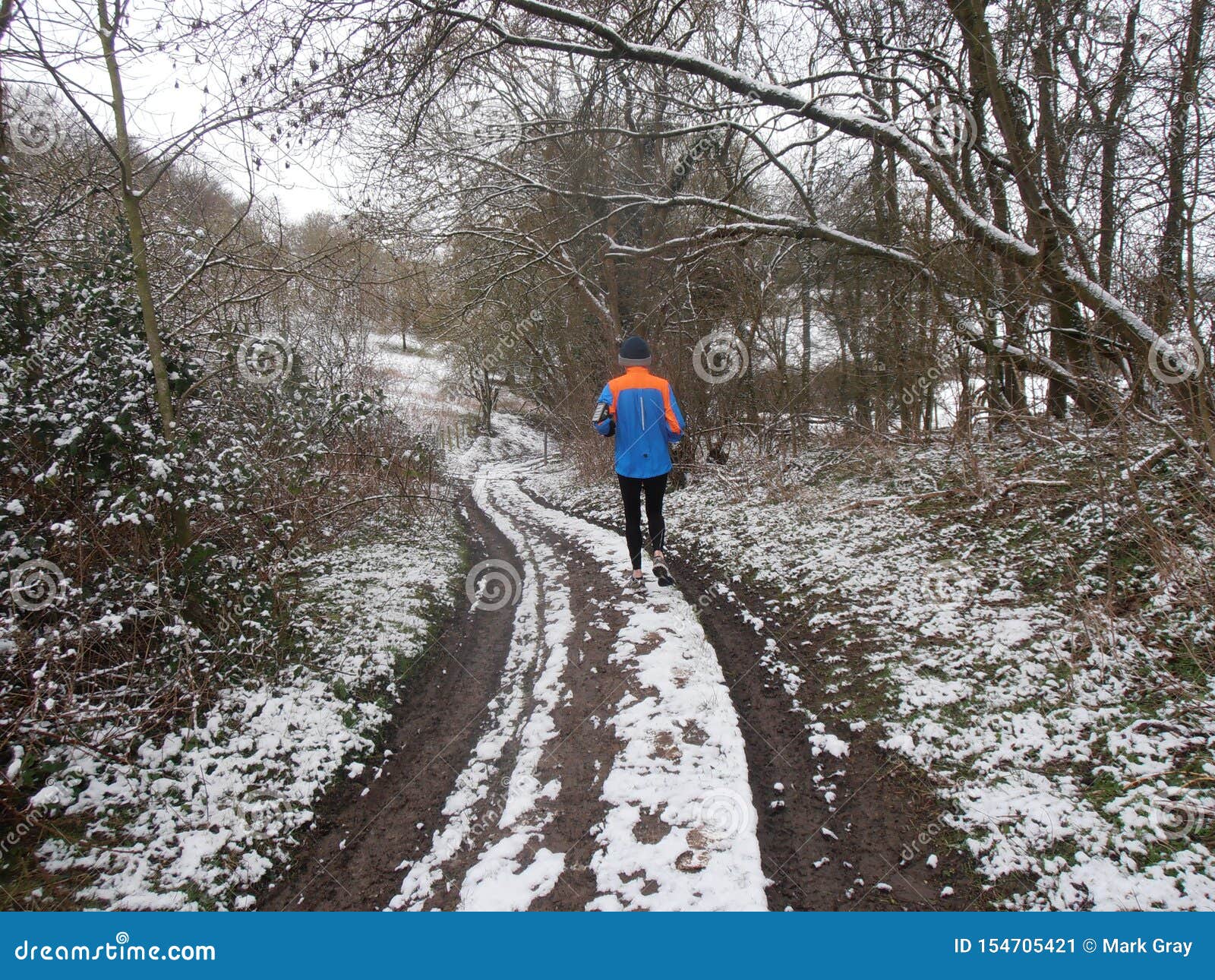 A Run in the Snow stock image. Image of jogger, snow - 154705421