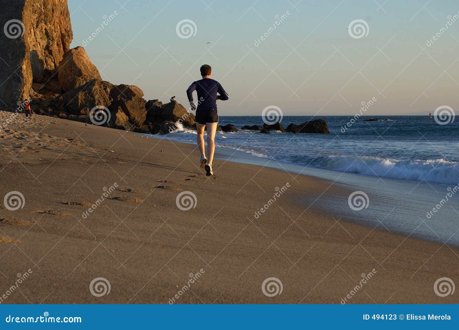 Runner on Beach Shore stock image. Image of footprints - 494123