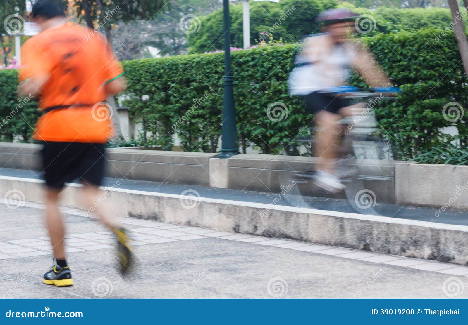 Runner and Biker Exercise in Park , Motion Blured Stock Photo - Image ...