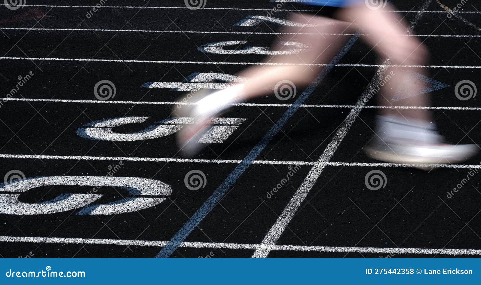 Runner Crossing the Finish Line of a Race on a Track Blurred Stock ...