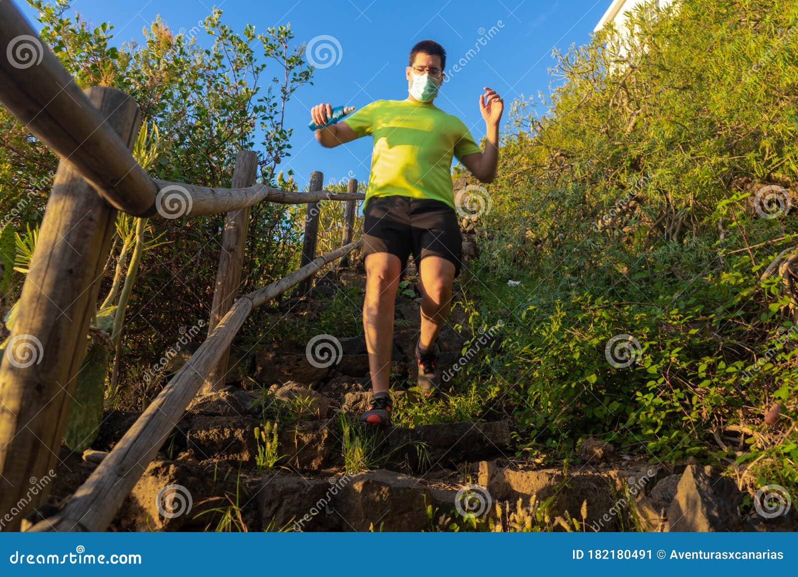 Runner with Face Mask Down a Path. Stock Image - Image of flask ...