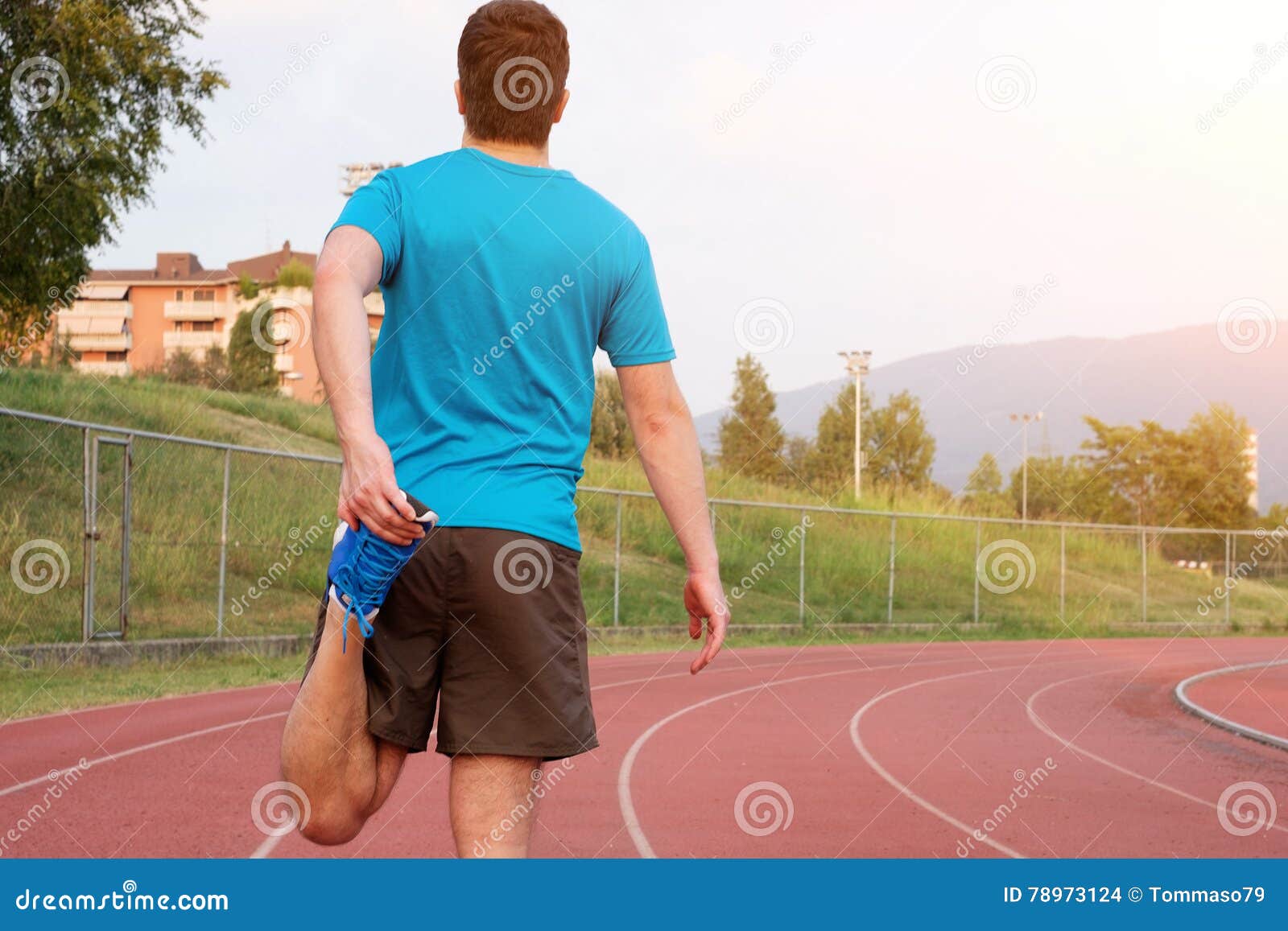 Runner with Injured Knee on the Track Stock Photo - Image of outdoor ...