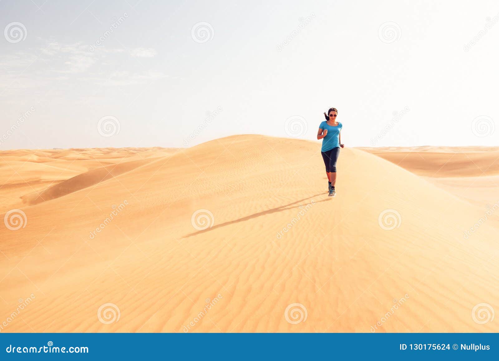 Jogging in the Desert stock photo. Image of alone, woman - 130175624