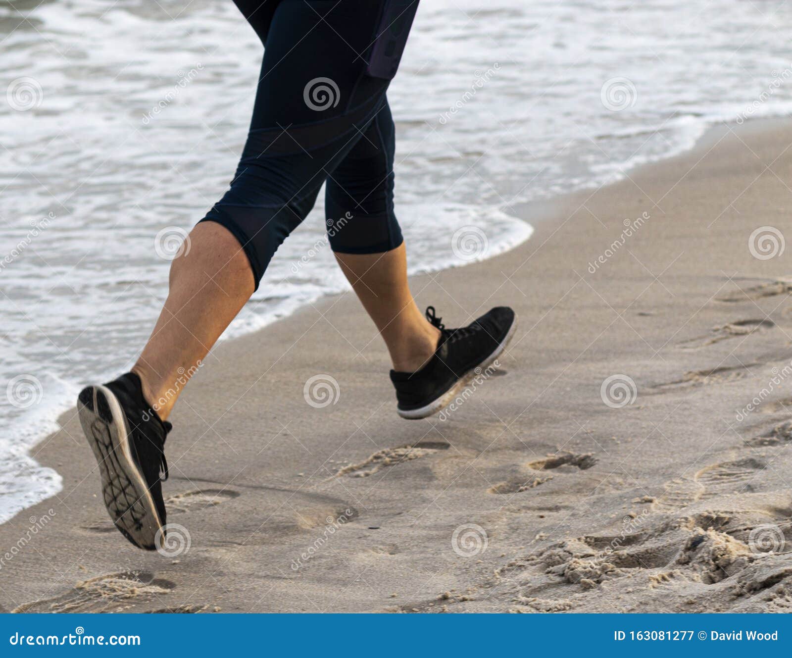 Runner Jogging on the Waters Edge on the Sand at the Beach Stock Image ...
