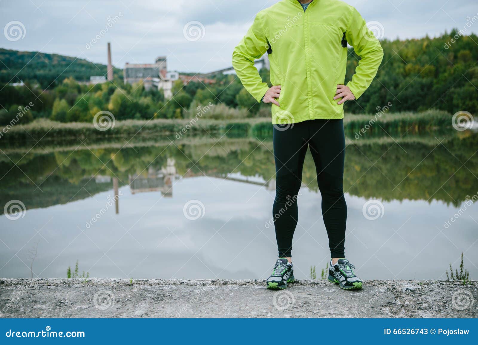 Runner at the Lake Resting Against Green Trees Stock Image - Image of ...
