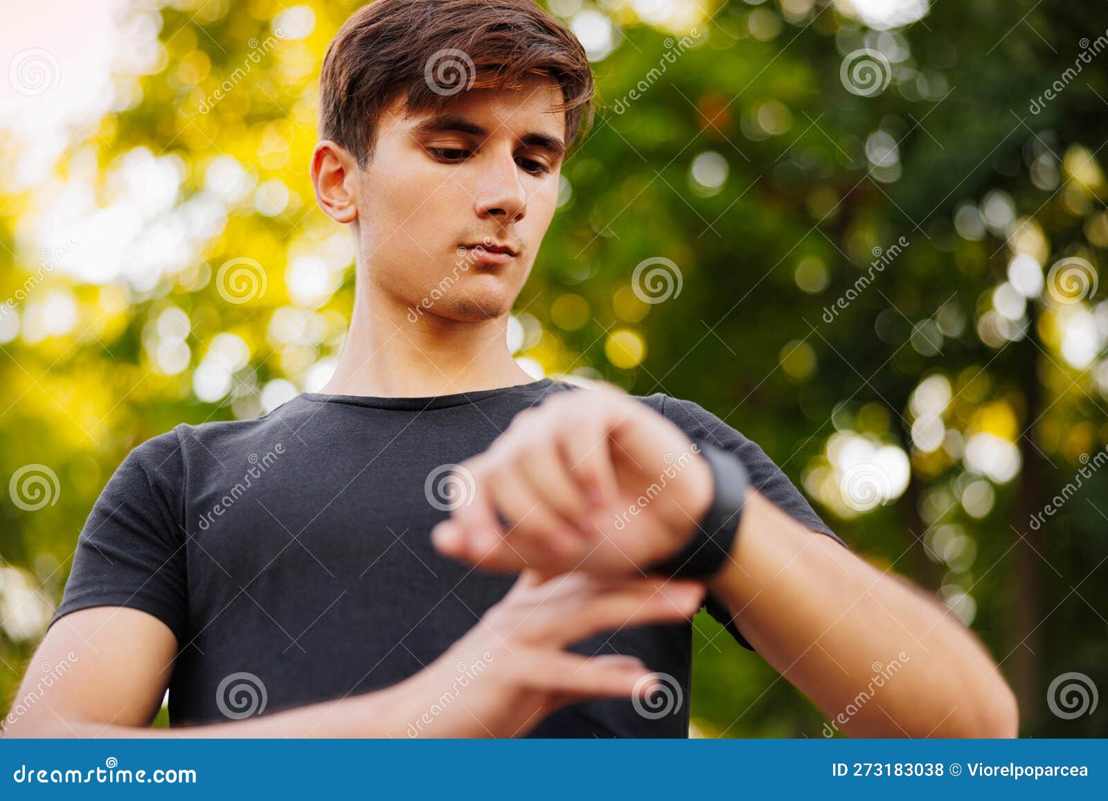 Runner on Mountain Trail Looking at Smartwatch or Sport Watch, Checking ...