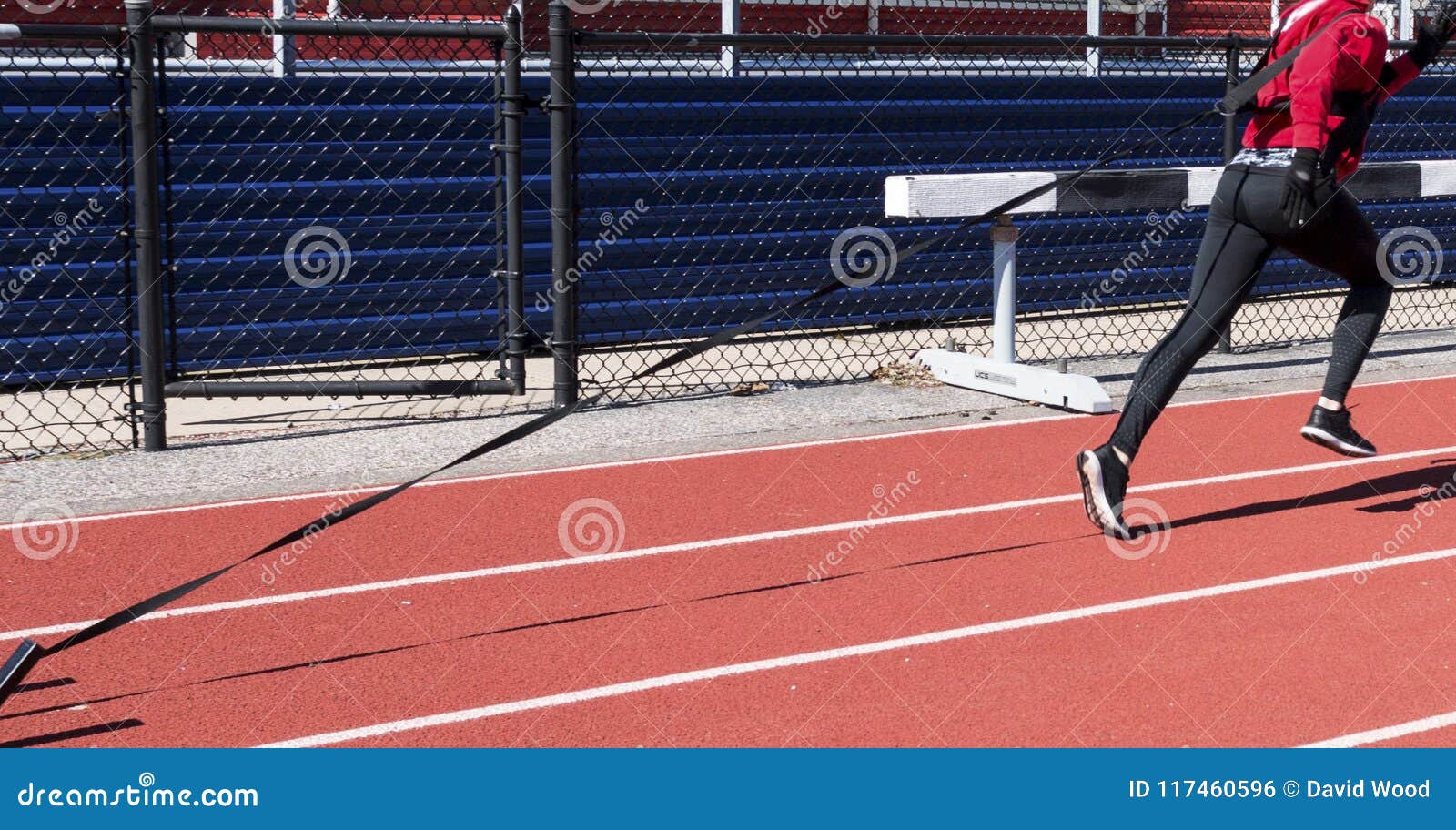 Runner Pulling Sled with Weights on a Track Stock Photo - Image of ...
