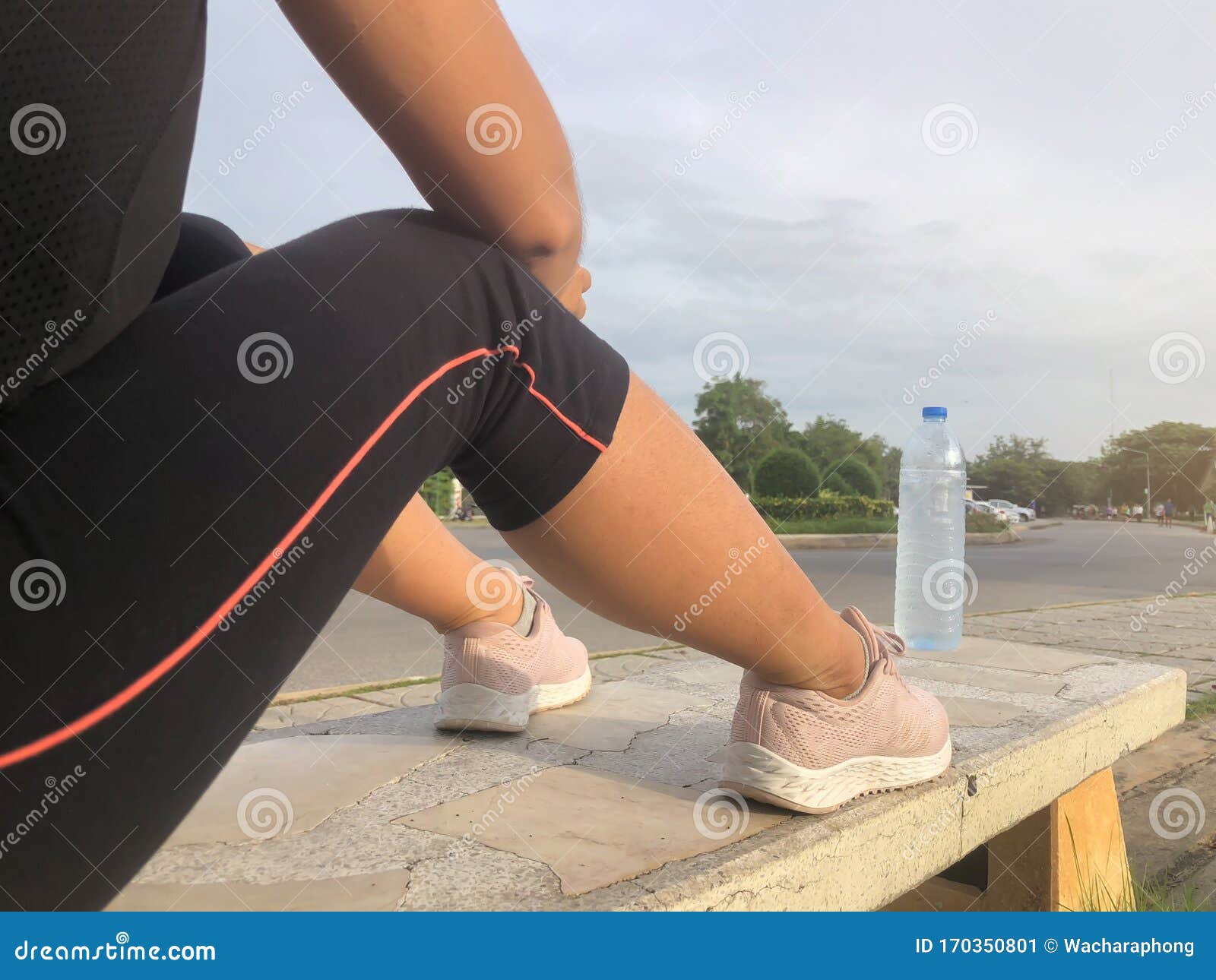 Runner relaxes muscles stock image. Image of athlete - 170350801