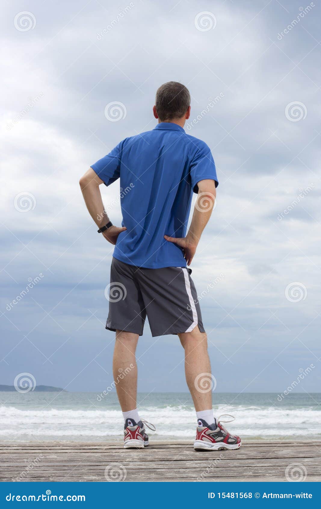 Runner relaxing on a beach stock photo. Image of adult - 15481568