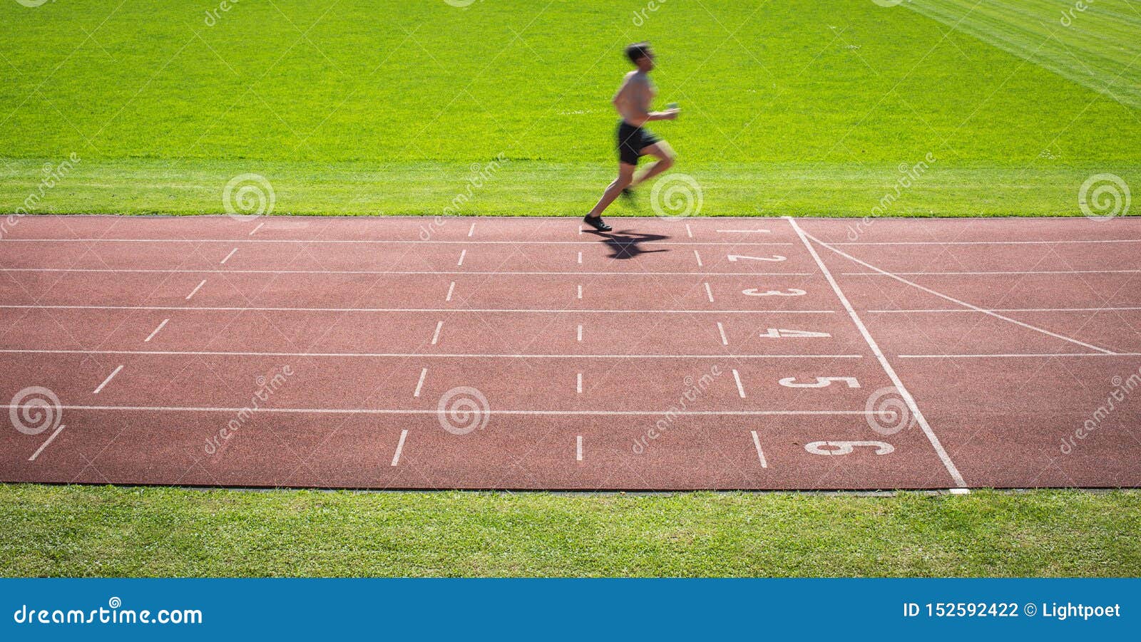 Runner on a Running Track Finishing a Race First Stock Photo - Image of ...