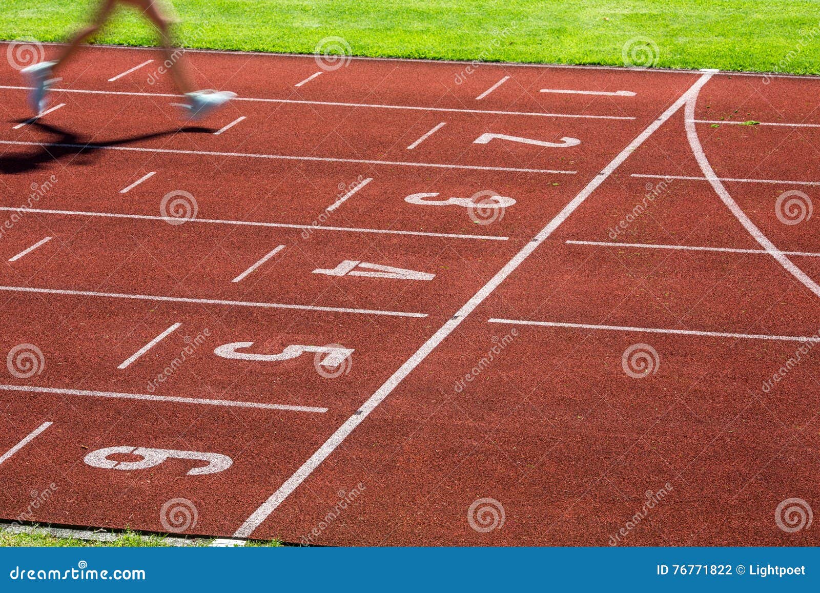 Runner on a Running Track Finishing a Race First Stock Photo - Image of ...