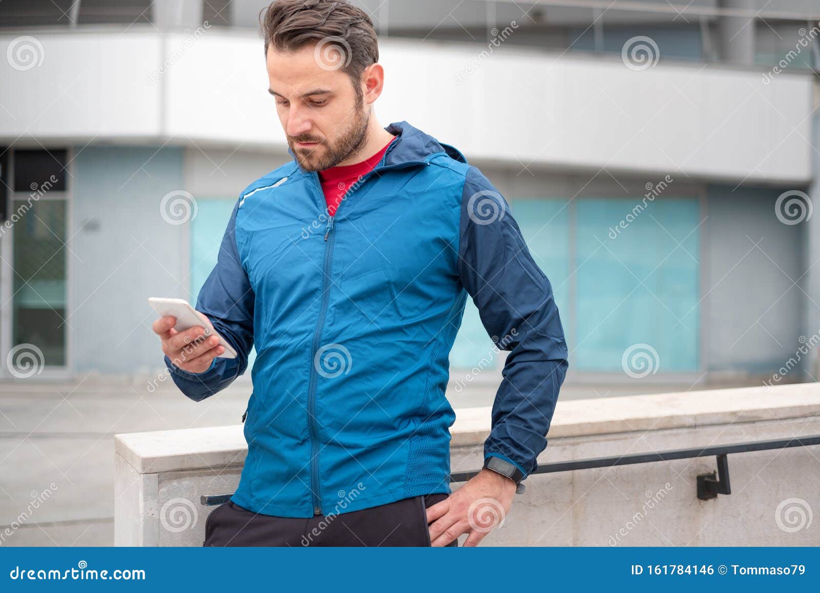 Runner Sportsman Holding Mobile Phone during Workout Stock Photo ...