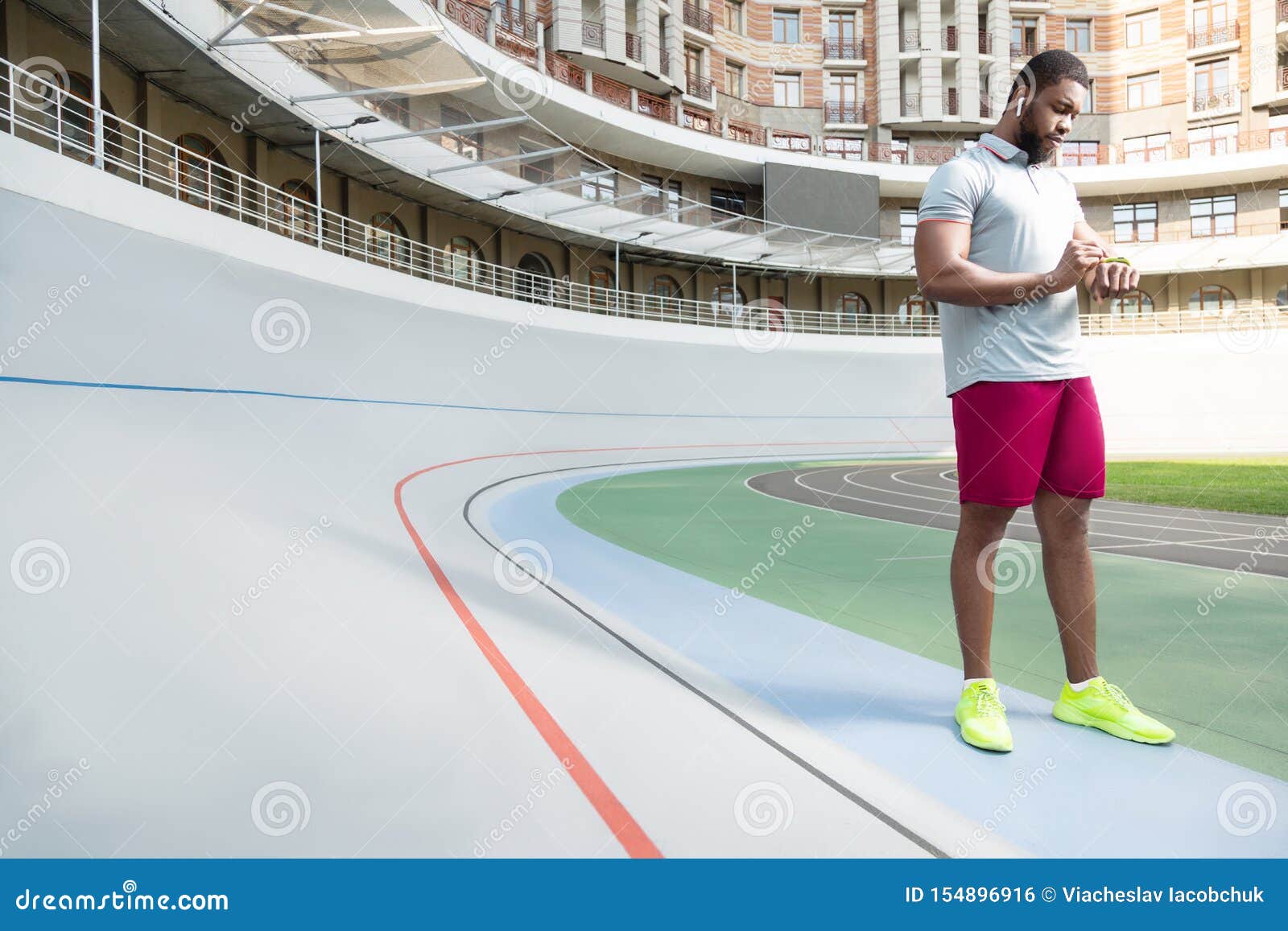 Runner Standing in Front of a High-rise Building Stock Photo - Image of ...