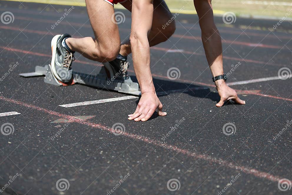 Runner on the Starting Blocks in Position Stock Photo - Image of ...