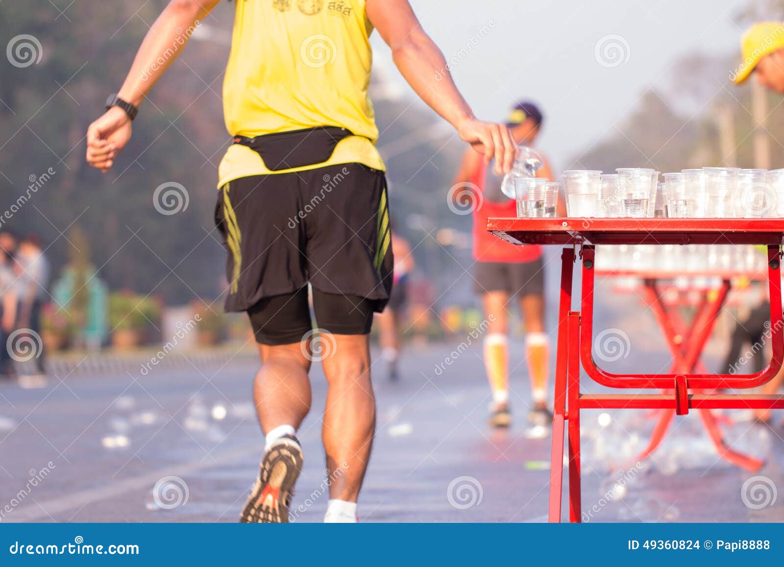 Runner Take a Water in a Marathon Race Editorial Stock Image - Image of ...