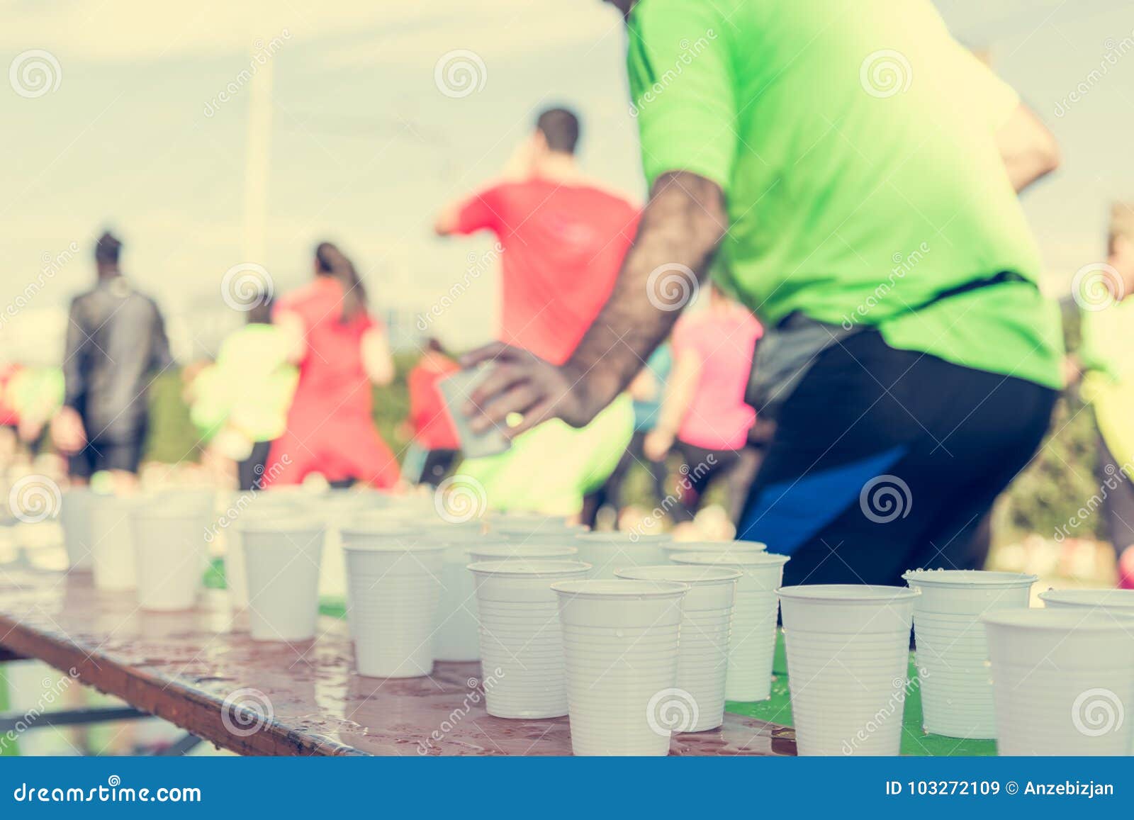 Runner Taking a Cup of Water at H20 Stand. Stock Image - Image of ...
