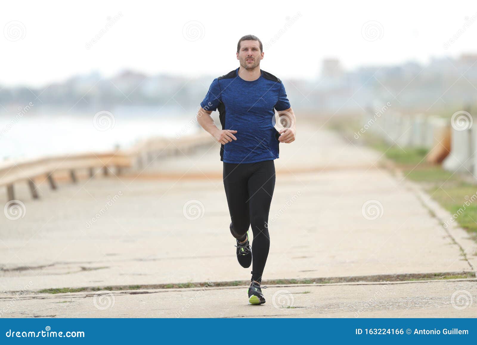 Runner Training Running Towards Camera Stock Photo - Image of alone ...