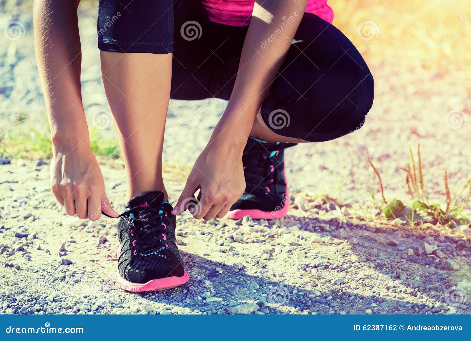 Runner Tying Her Shoe Laces Stock Photo - Image of girl, athletic: 62387162