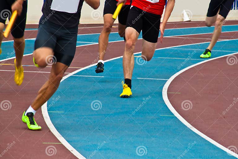 Runners on an Athletic Tarck Stock Image - Image of team, championship ...