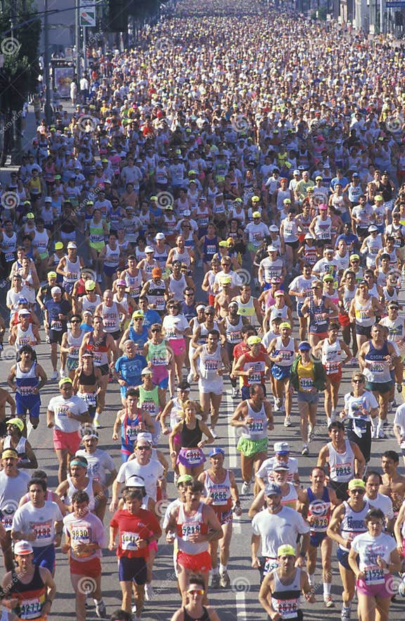 Runners Crossing Finish Line Editorial Photography - Image of angeles ...