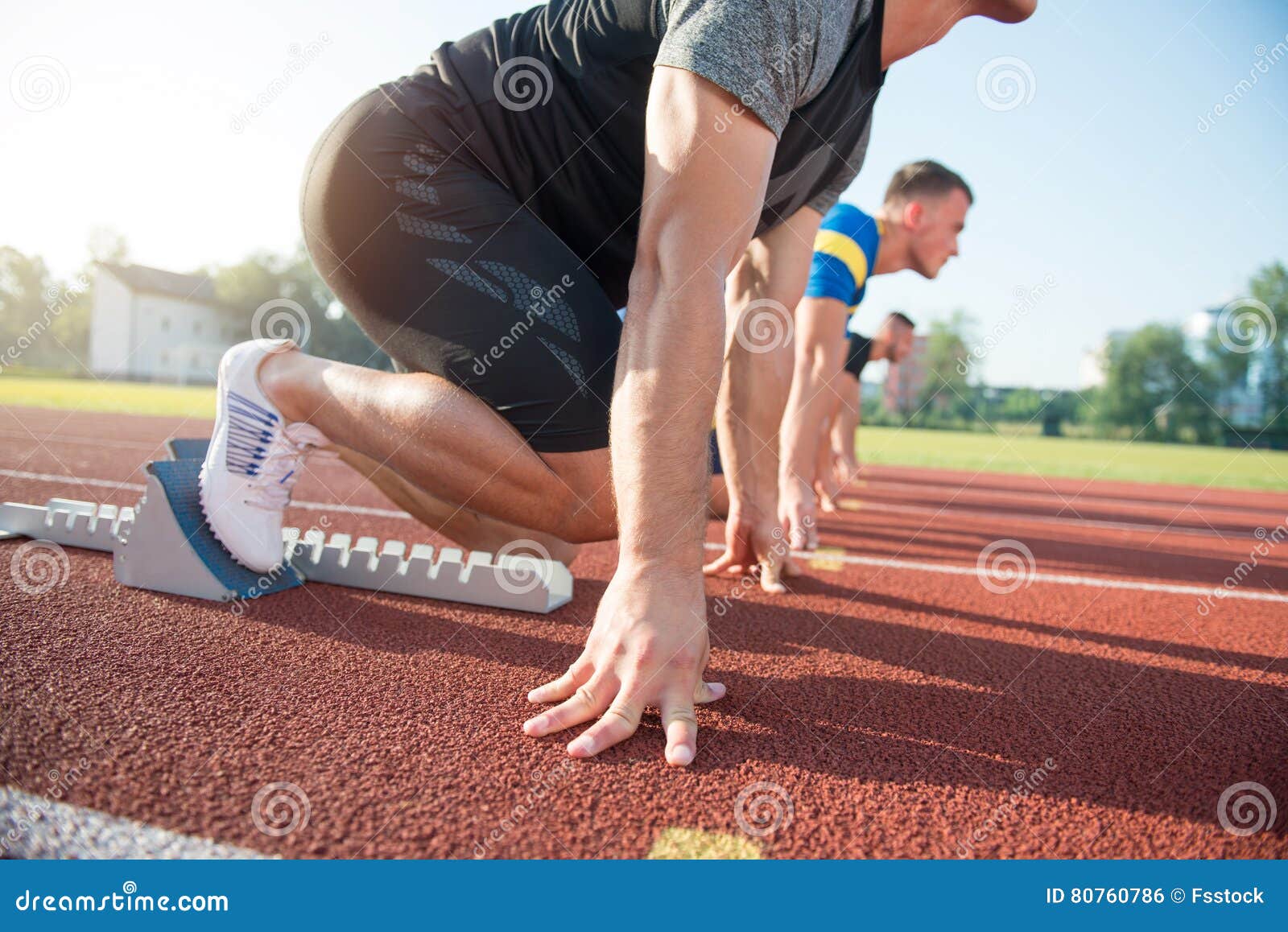 Runners Preparing for Race at Starting Blocks Stock Photo - Image of ...