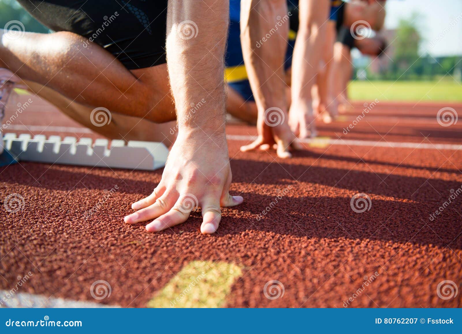 Runners Preparing for Race at Starting Blocks Stock Image - Image of ...