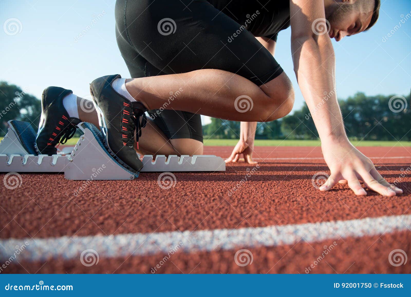 Runners Preparing for Race at Starting Blocks Stock Photo - Image of ...