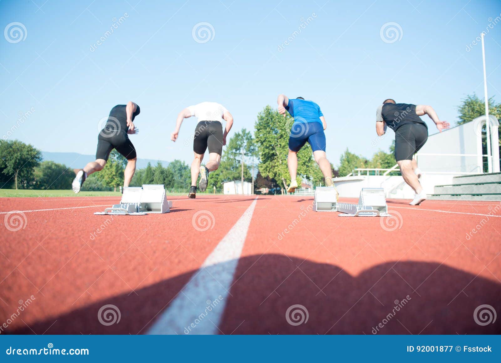 Runners Preparing for Race at Starting Blocks Stock Image - Image of ...