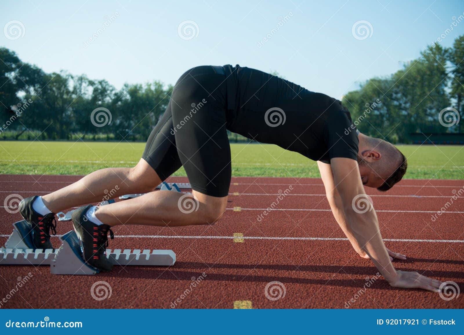 Runners Preparing for Race at Starting Blocks Stock Image - Image of ...
