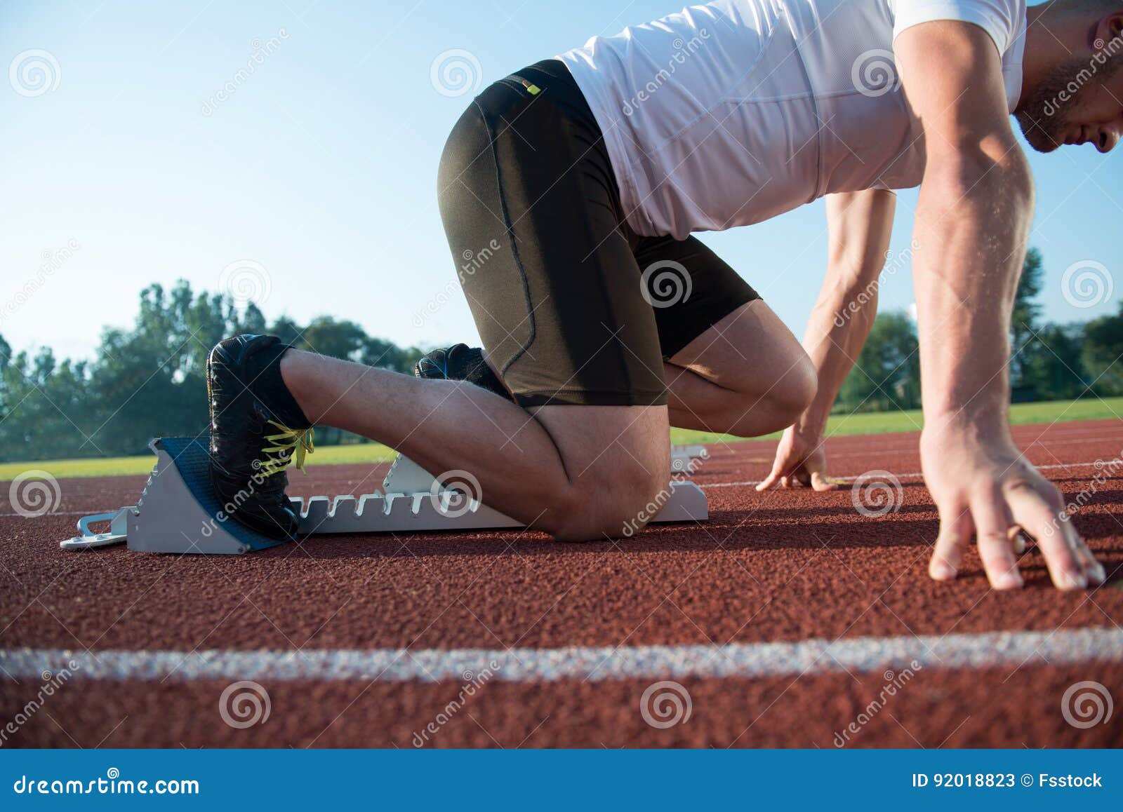 Runners Preparing for Race at Starting Blocks Stock Image - Image of ...