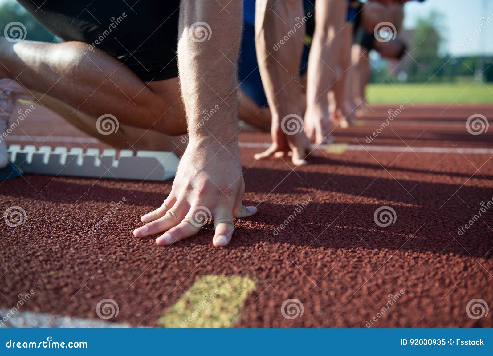 Runners Preparing for Race at Starting Blocks Stock Image - Image of ...