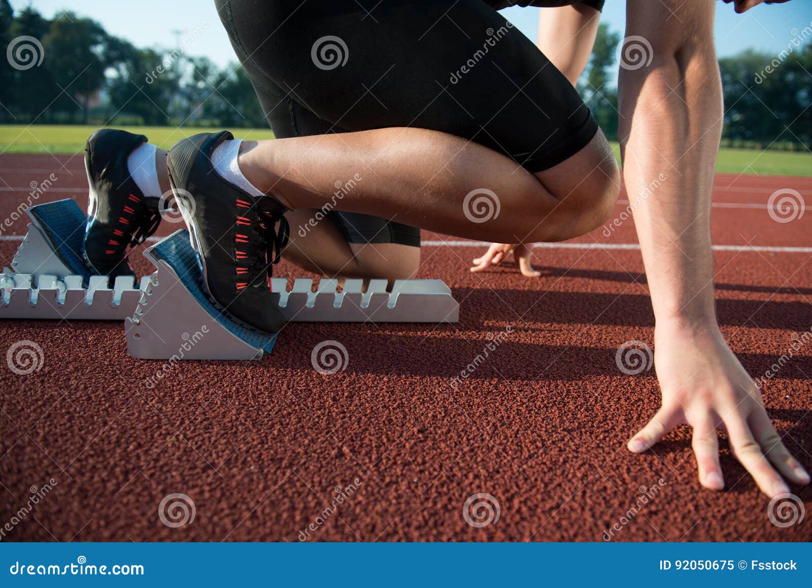 Runners Preparing for Race at Starting Blocks Stock Image - Image of ...