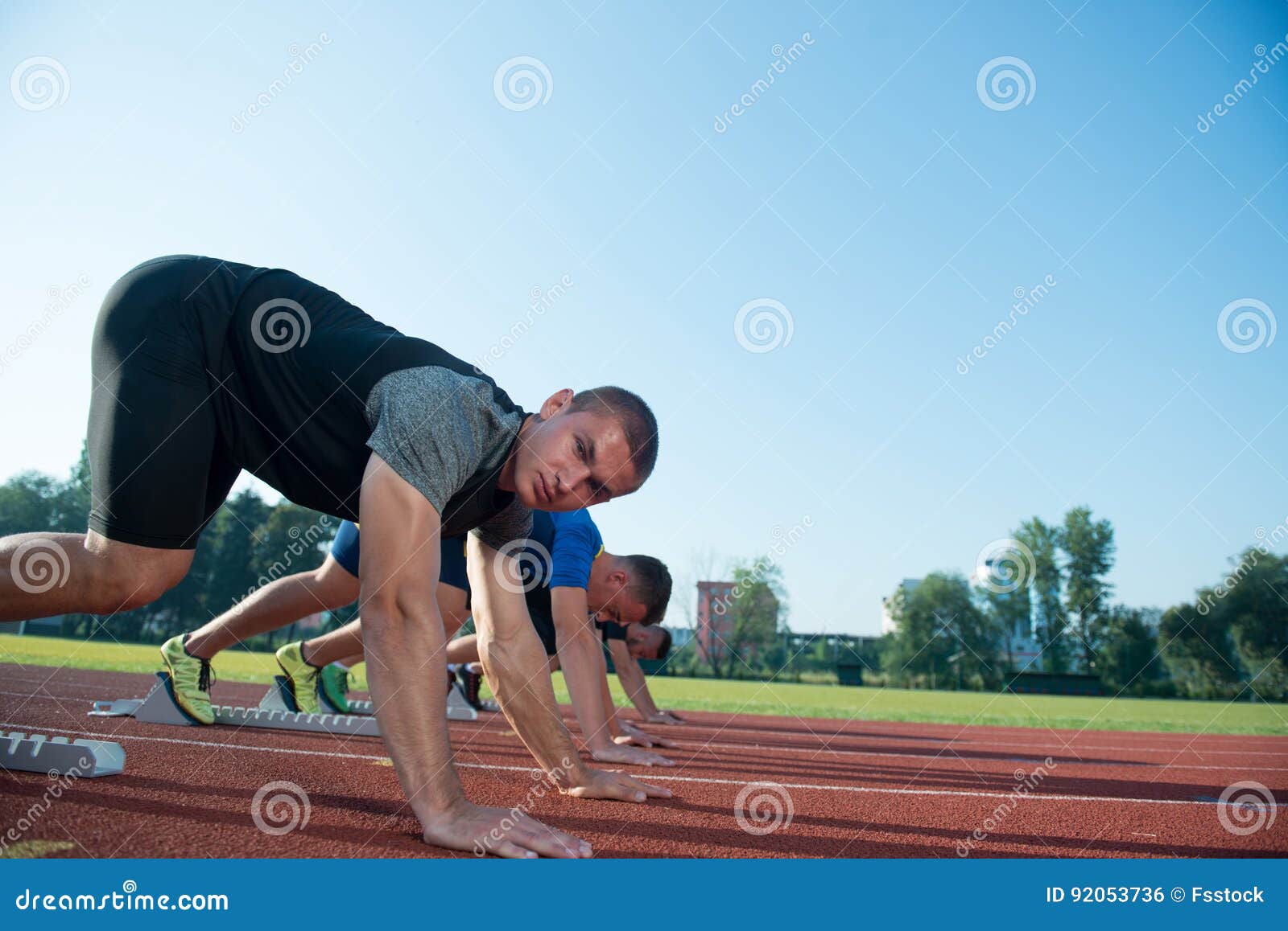 Runners Preparing for Race at Starting Blocks Stock Photo - Image of ...