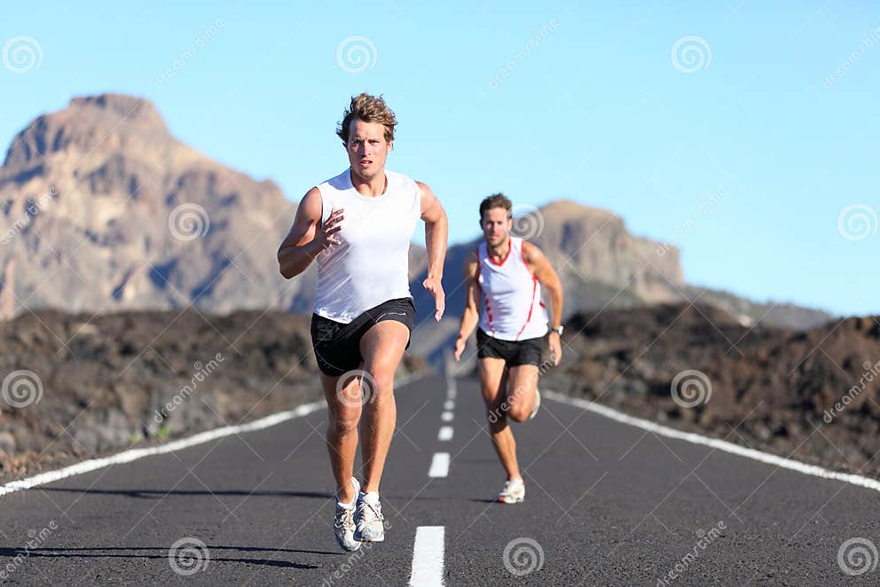 Runners running on road stock image. Image of outside - 19531461