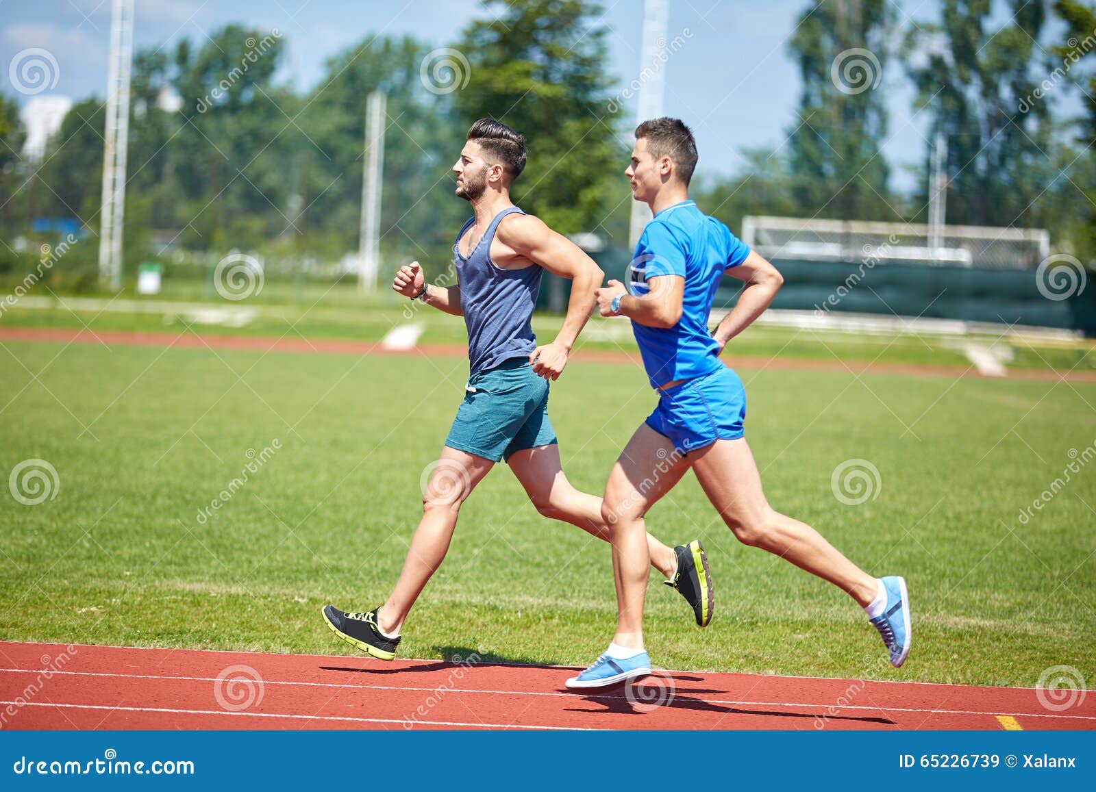 Runners on track stock image. Image of determined, friends - 65226739