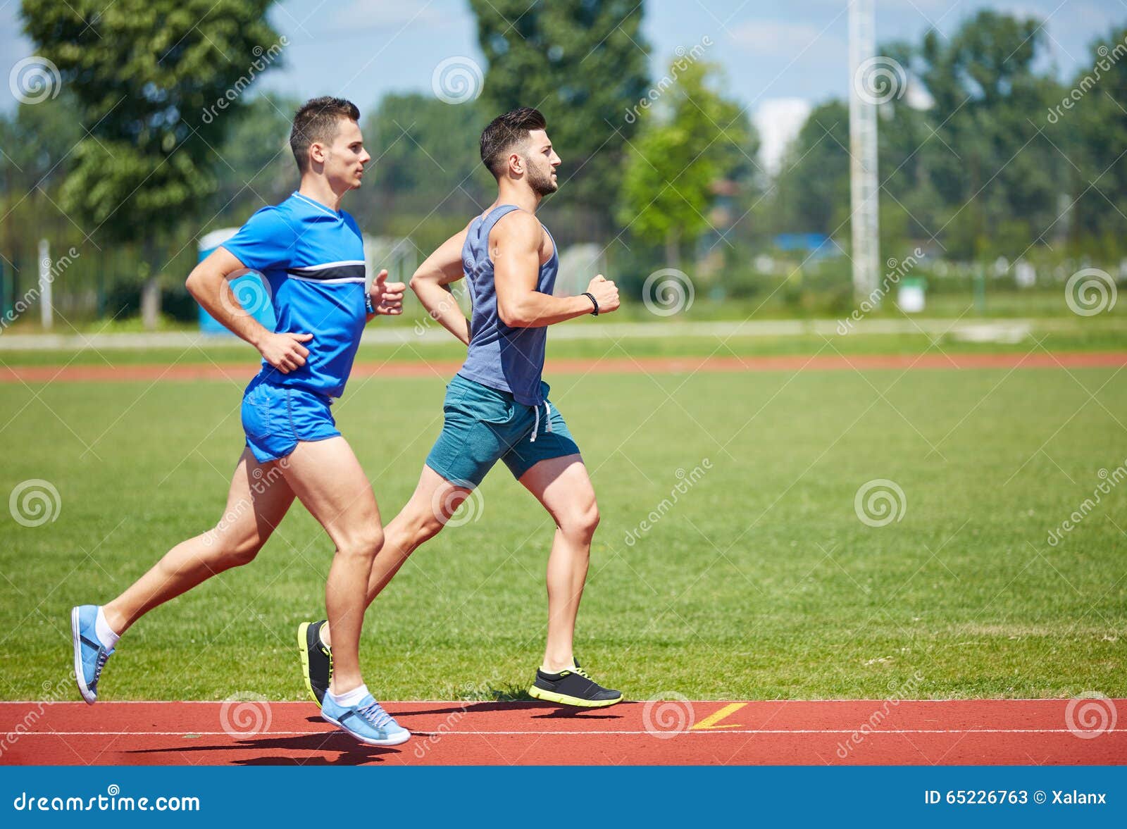 Runners on track stock image. Image of people, active - 65226763