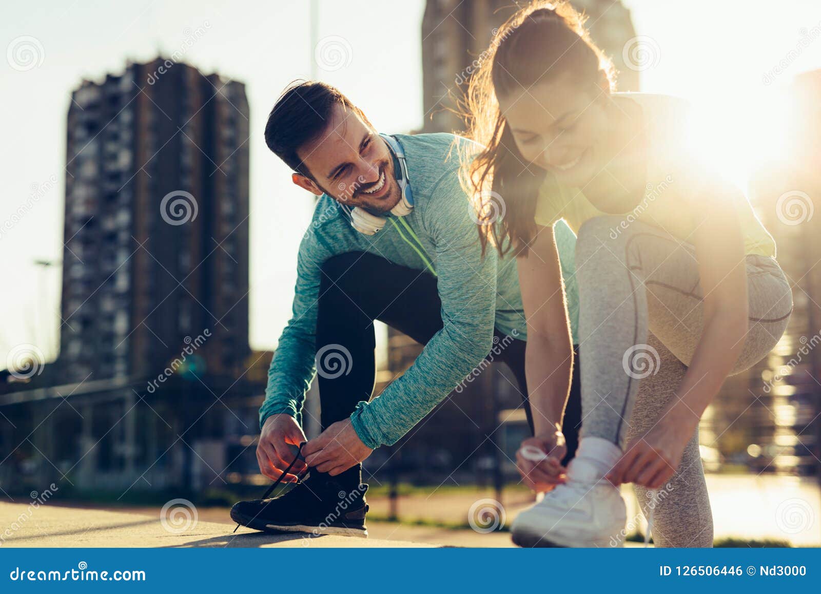 Runners Tying Running Shoes and Getting Ready To Run Stock Photo ...